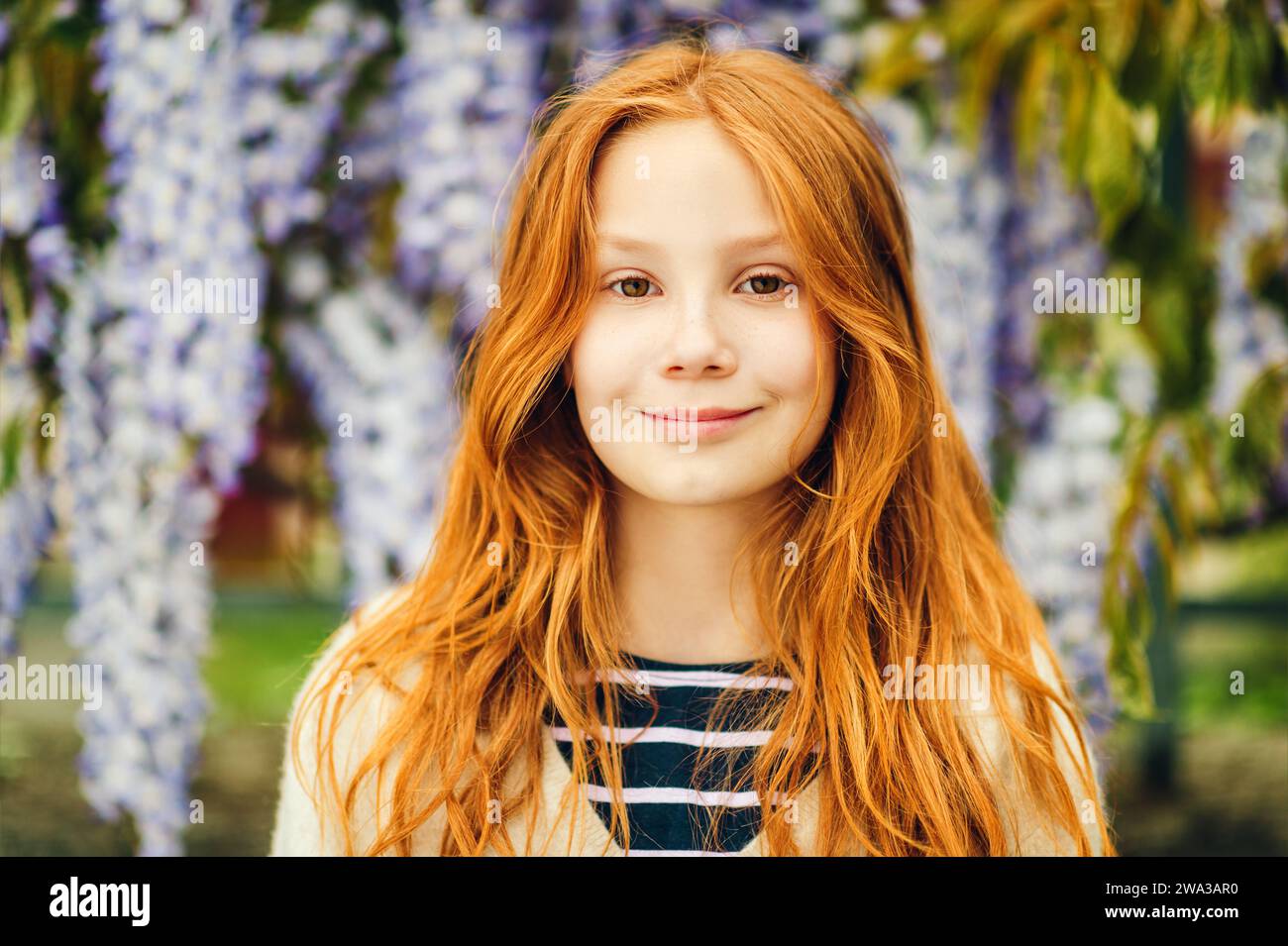 Close up portrait of adorable 9-10 year old red-haired kid girl posing ...