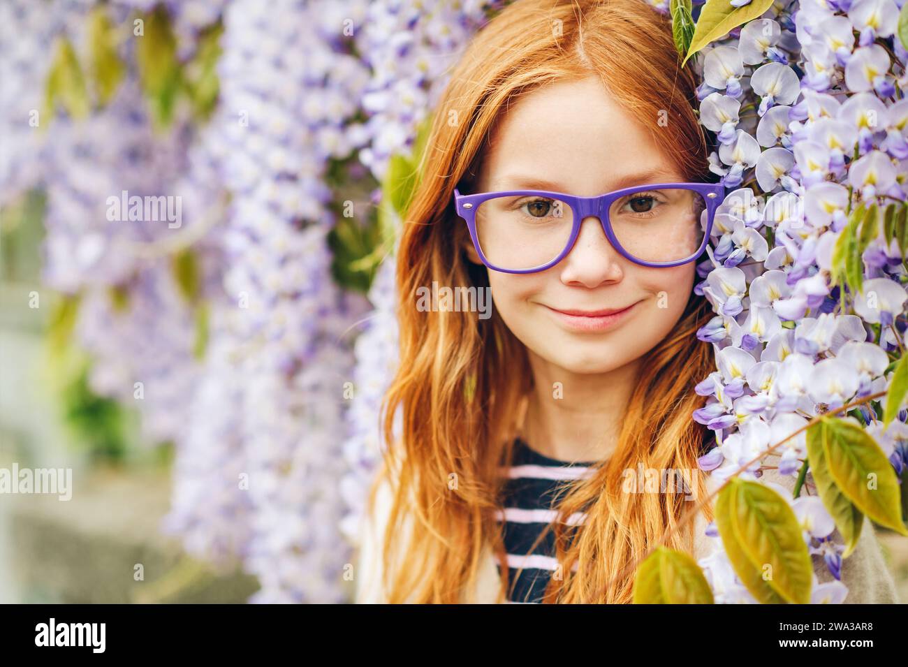 Close up portrait of adorable 9-10 year old red-haired kid girl posing ...