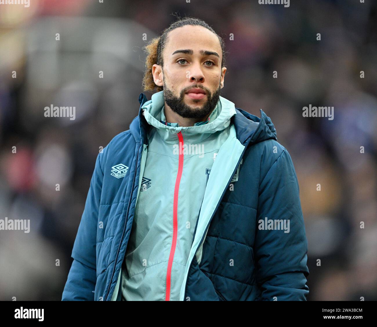 Marcus Harness of Ipswich Town walks towards the bench ahead of kick ...