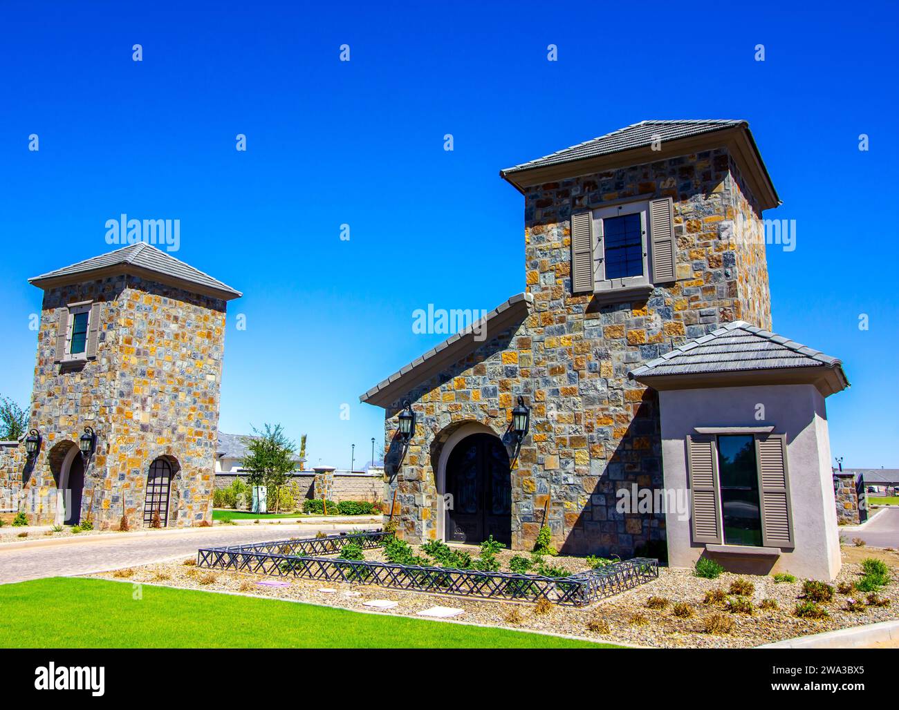 Gate Houses Guarding Entrance To Secure Subdivision Stock Photo - Alamy