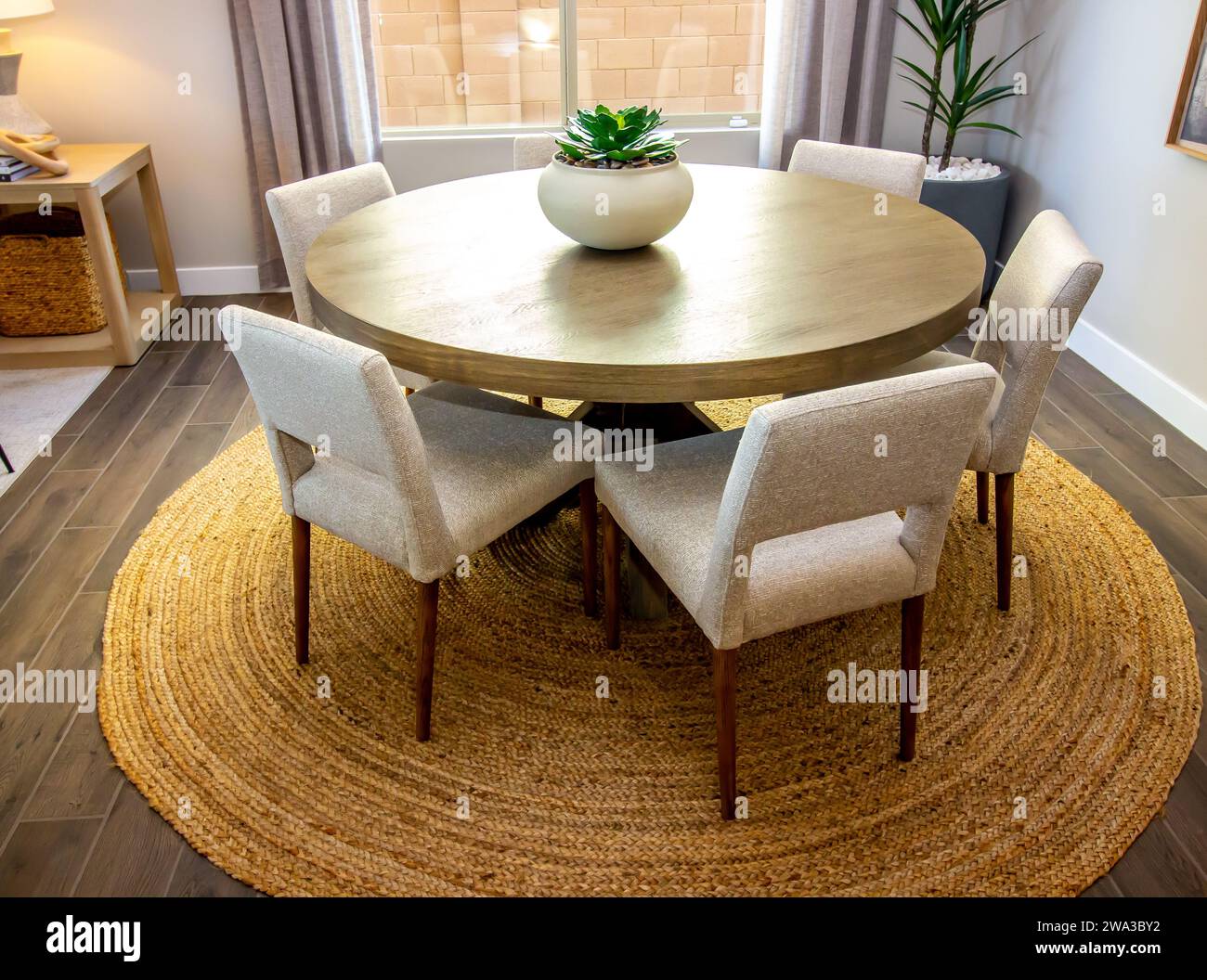 Round Wooden Table With Five Chairs In Eating Area Stock Photo - Alamy
