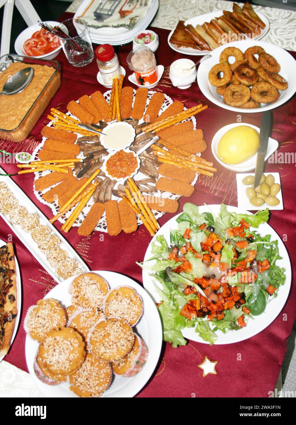 Dining table with fast food Stock Photo - Alamy