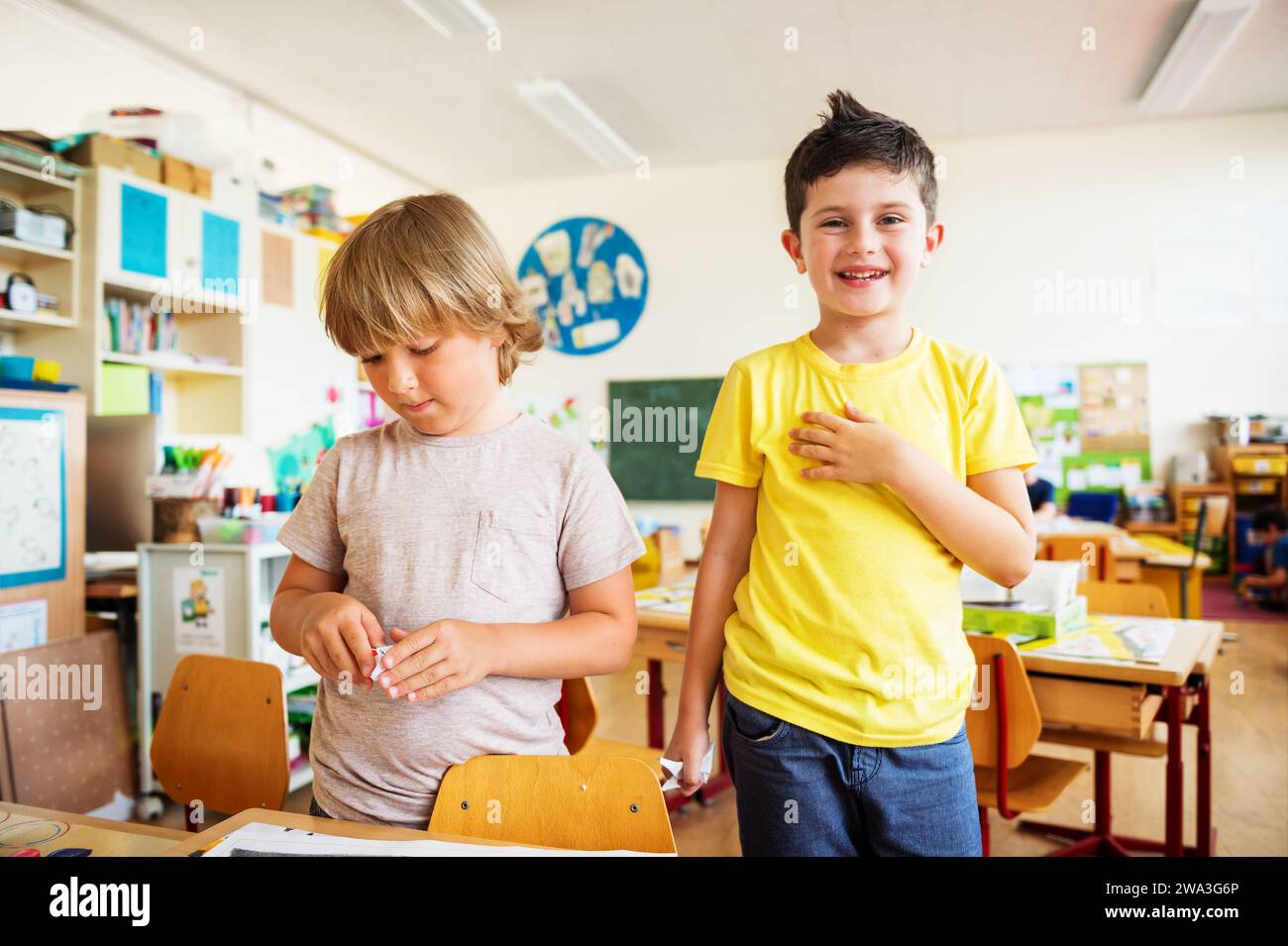 Cute little boys working in classroom, education, back to school ...