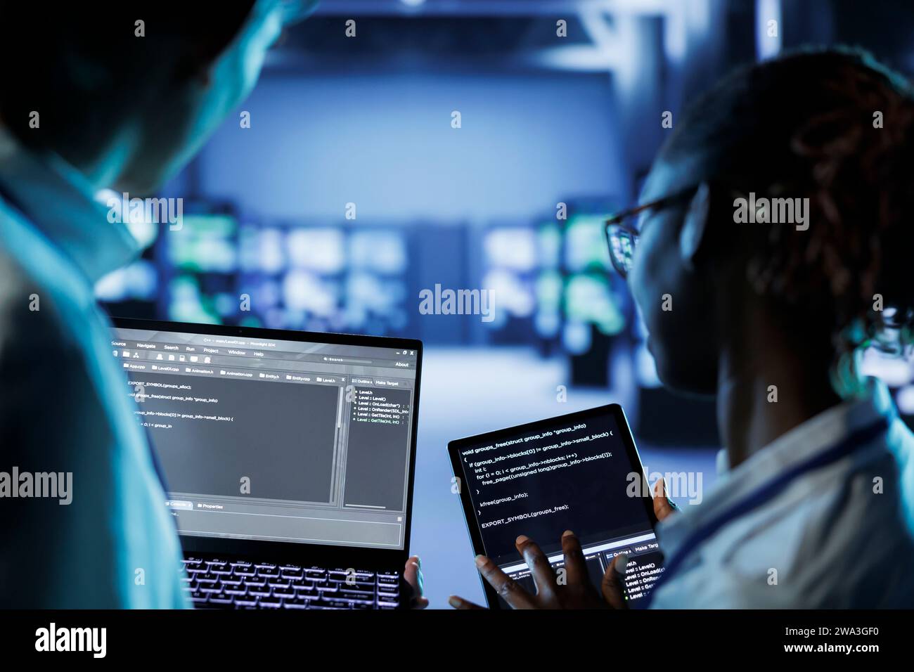IT developers building firewall systems in server room housing advanced ...