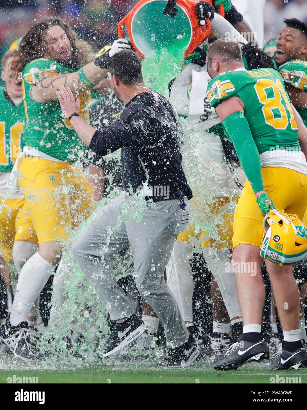 Glendale, Arizona, USA. 1st Jan, 2024. Head coach Dan Lanning of the Oregon Ducks gets Gatorade ...