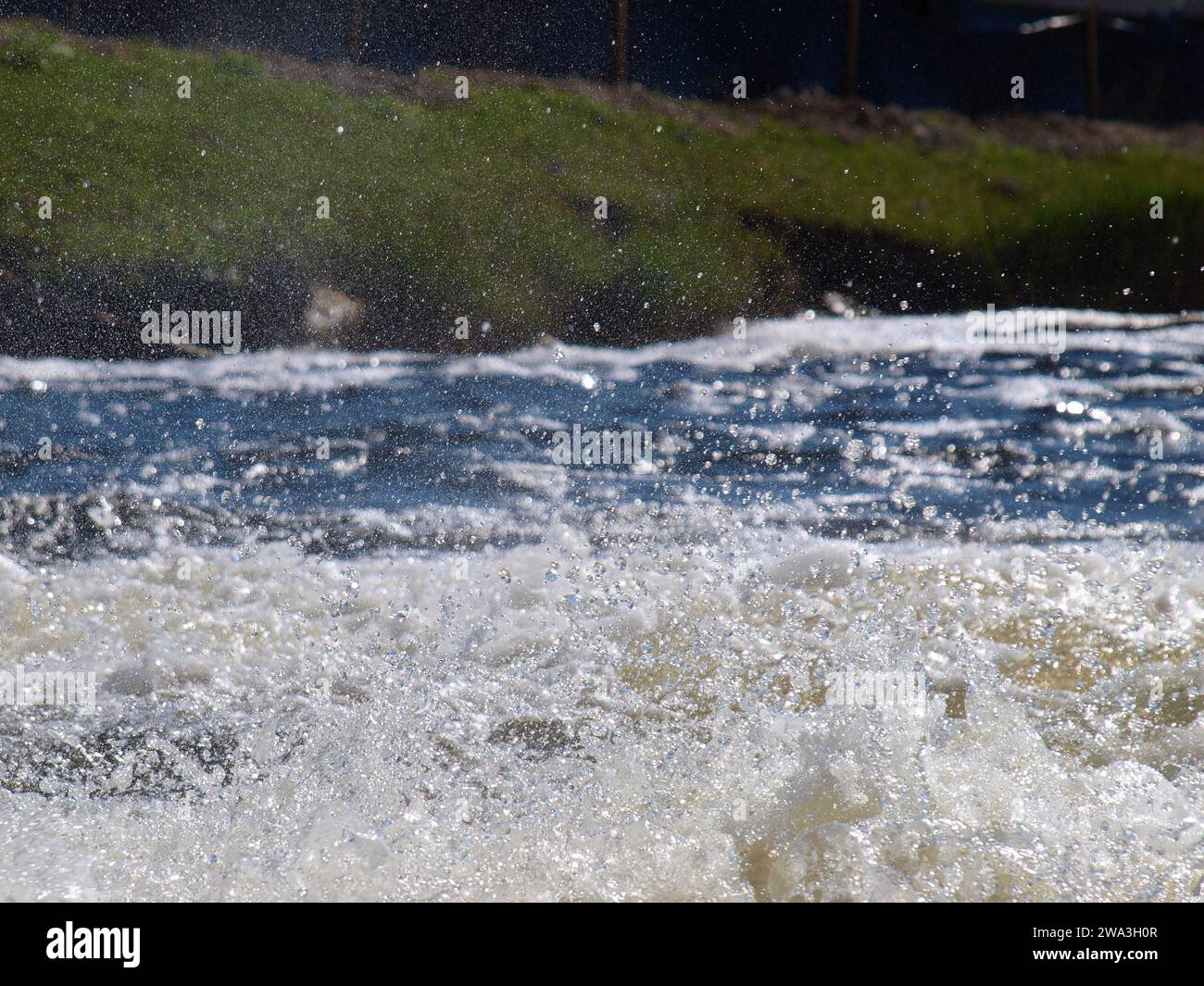 Water rapids creating bubbles in the air Stock Photo - Alamy