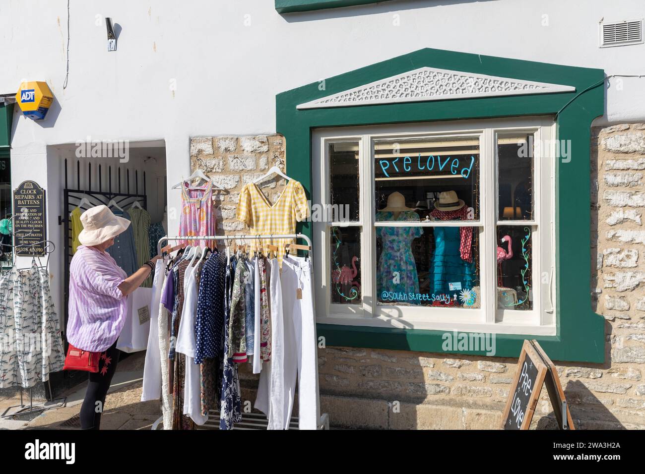 Woman model released browsing recycled clothes at a pre loved clothing ...