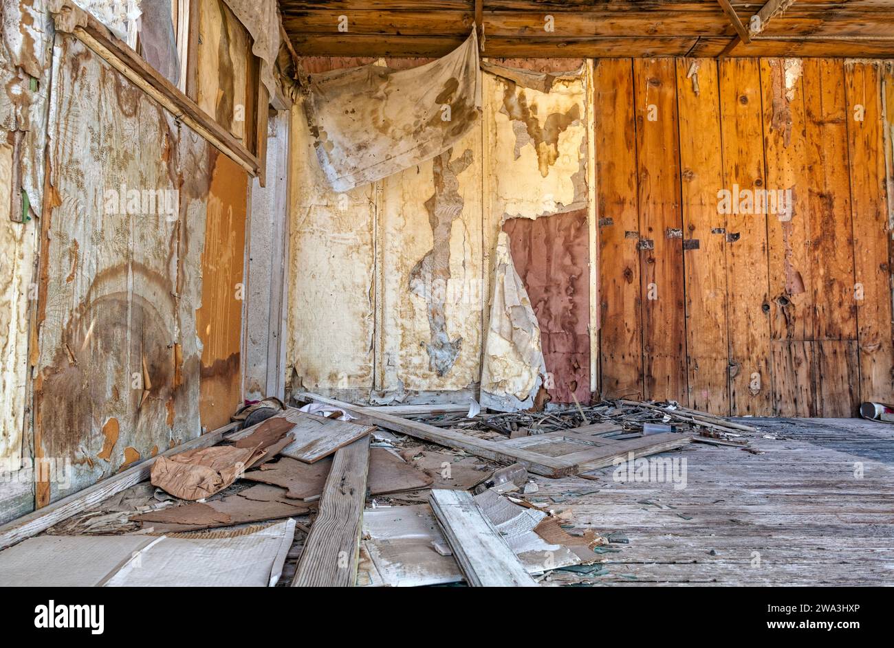 Interior of an abandoned shack at a mining ghost town in the desert of ...