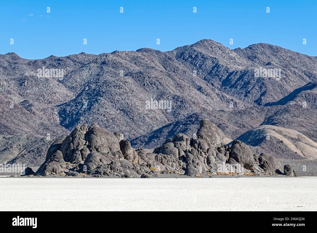 The Grandstand rock formation rises from the Racetrack Playa at Death ...