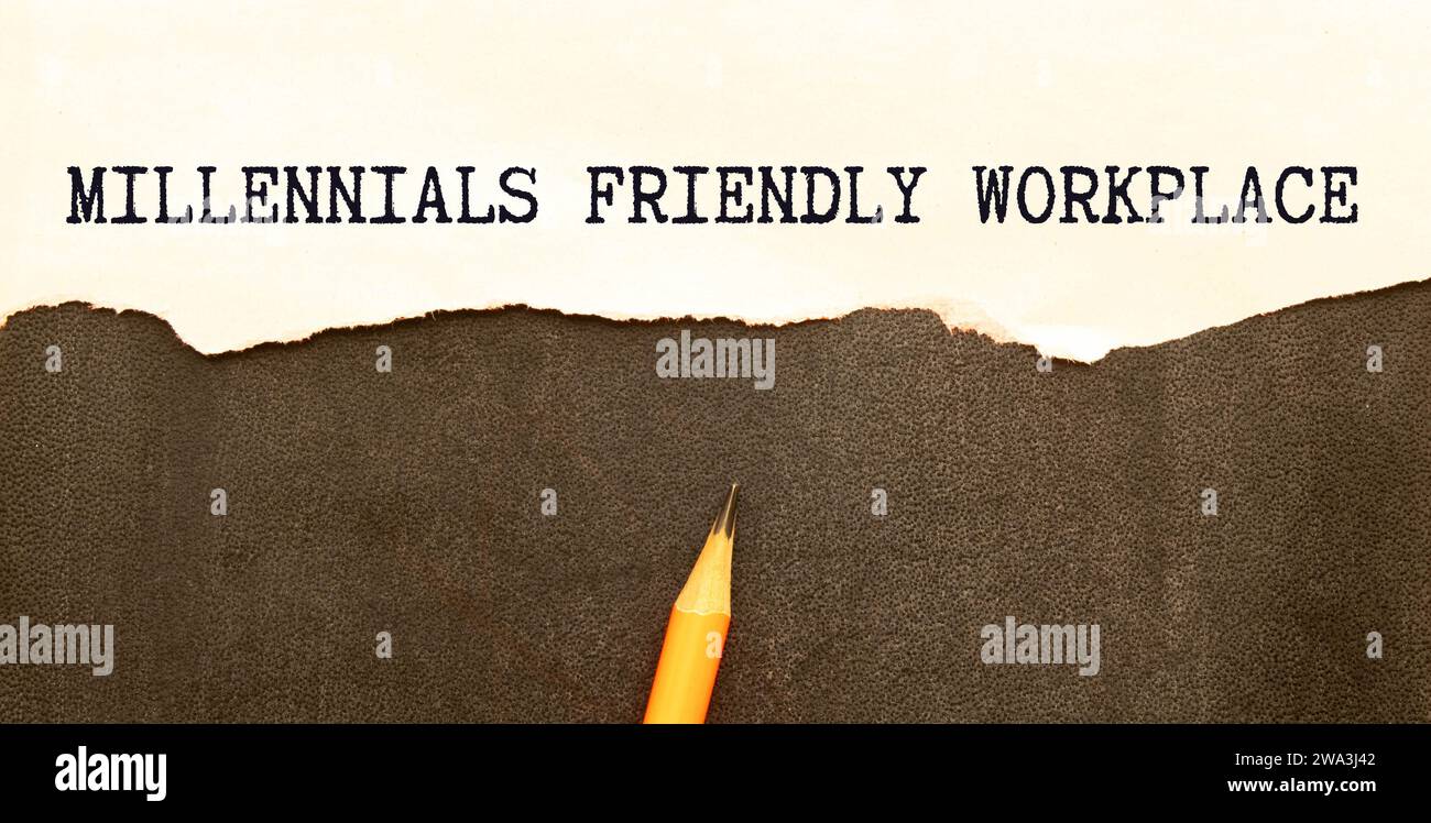 Closeup on businessman holding a card with text MILLENNIALS FRIENDLY ...