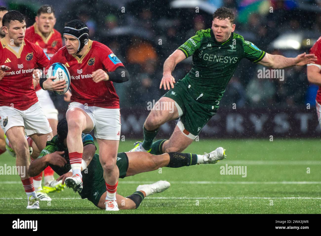 Galway, Ireland. 01st Jan, 2024. Rory Scannell of Munster tackled by ...