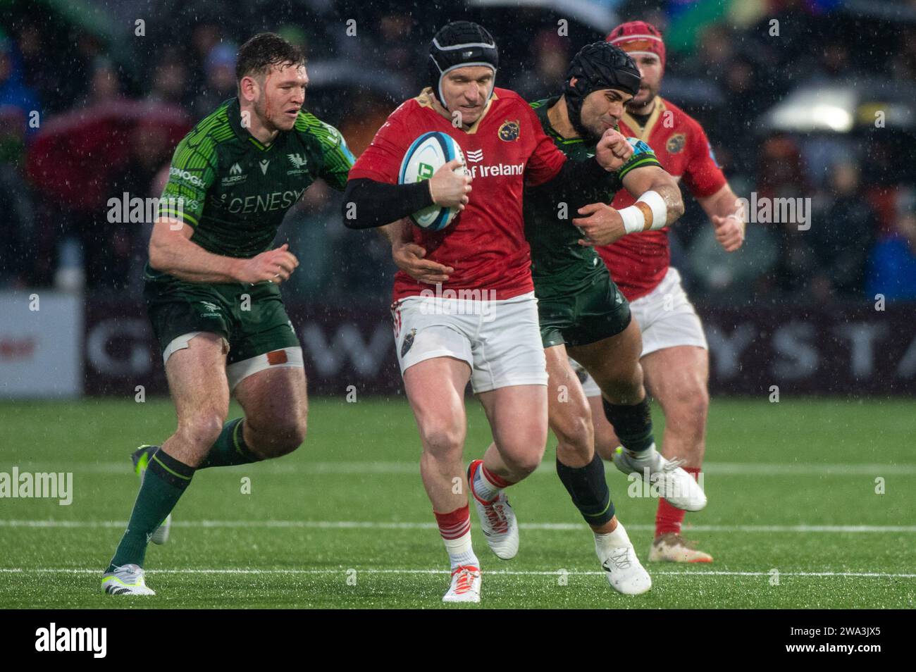 Galway, Ireland. 01st Jan, 2024. Rory Scannell of Munster tackled by ...