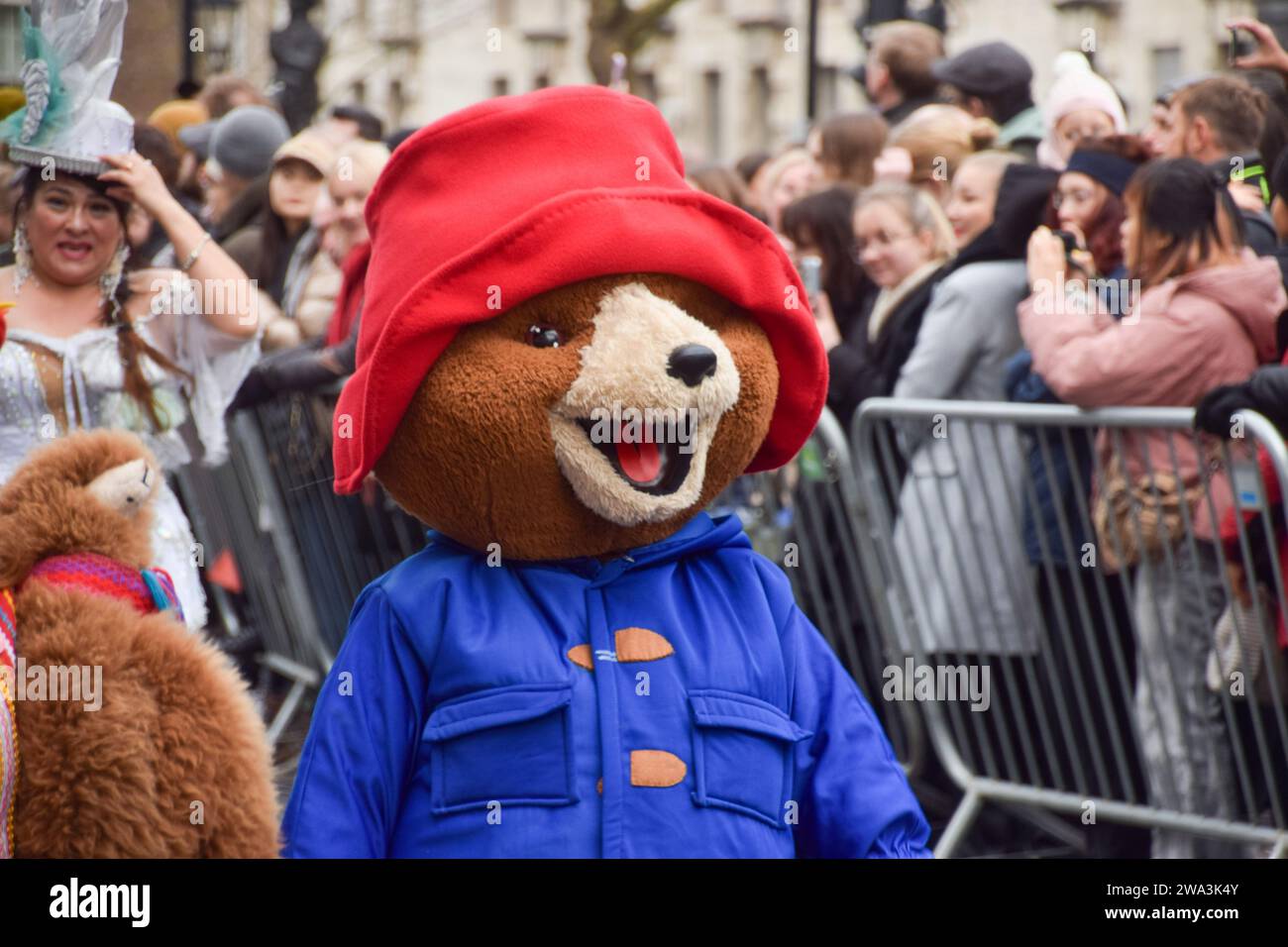 London, UK. 1st January 2024. Paddington Bear passes through Whitehall ...