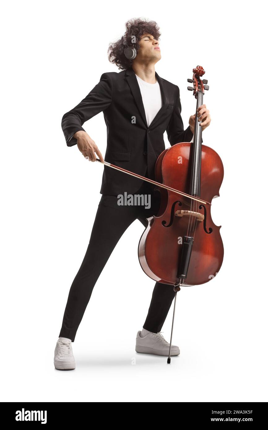 Full length portrait of a male artist with headphones playing a cello ...