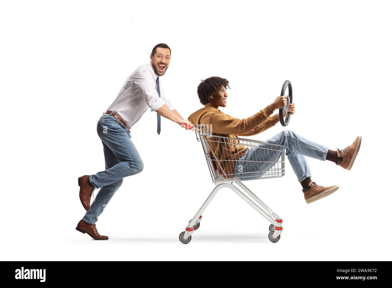 Man running and pushing an african american guy inside a shopping cart ...