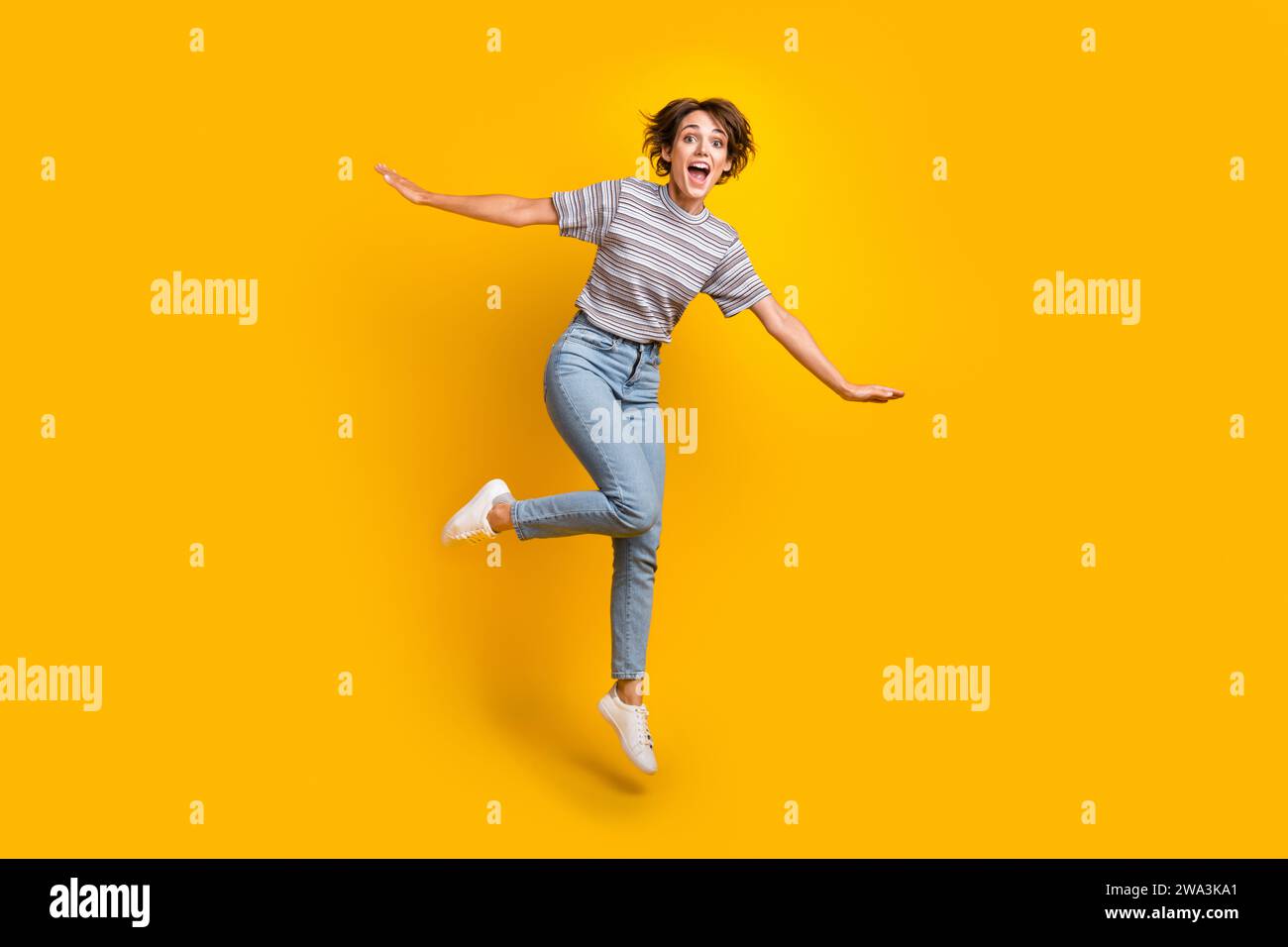 Full size portrait of astonished carefree girl hands wings flying ...