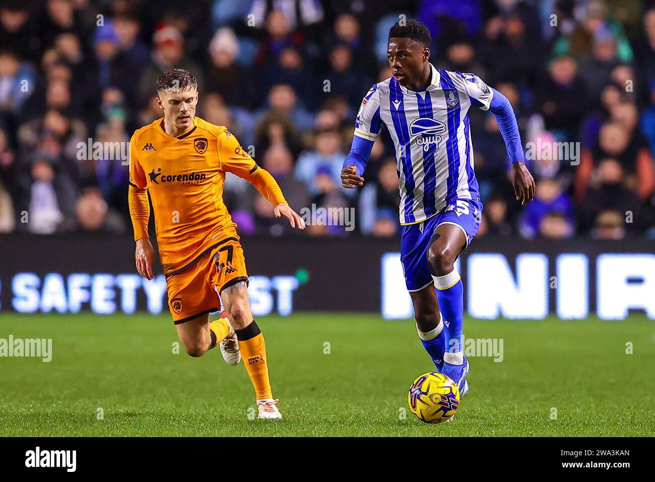 Regan Slater 27 of Hull City chases down Anthony Musaba 45 of Sheffield ...