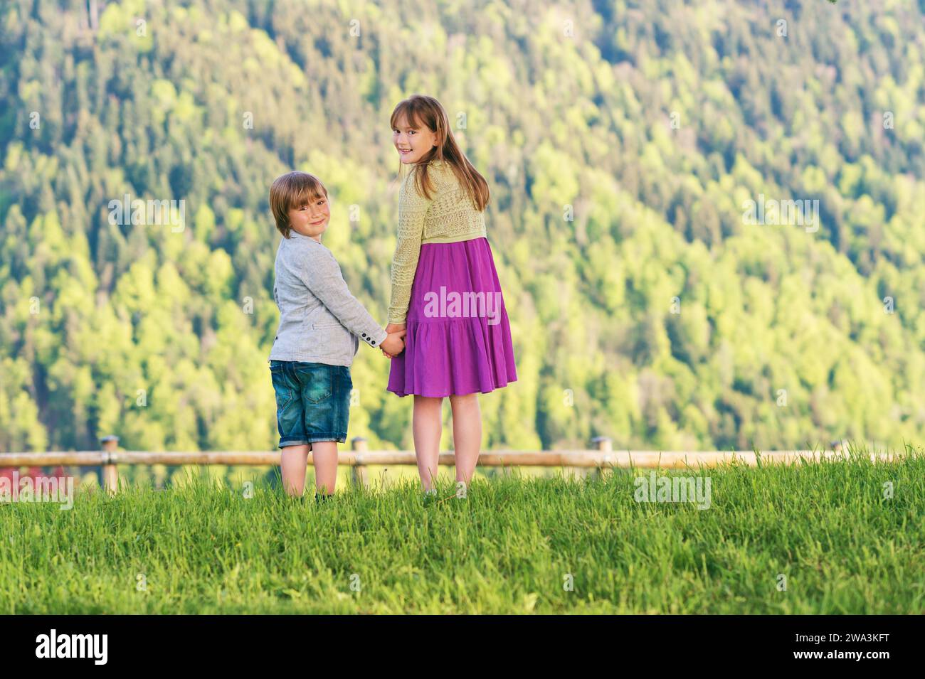 Two kids little boy and girl resting in swiss Alps over Montreux ...