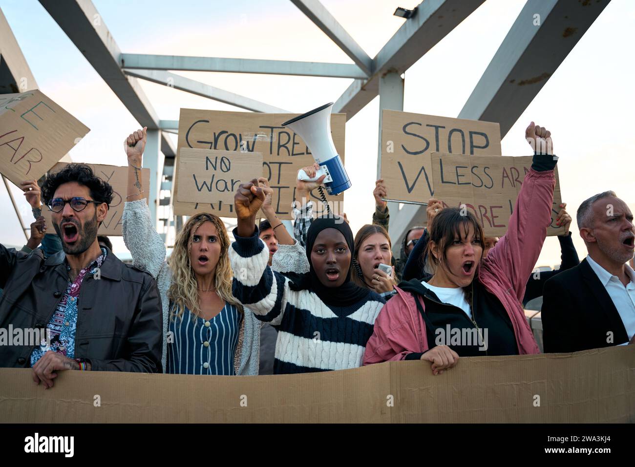 Serious multiracial group demonstrating against the war and violence in ...