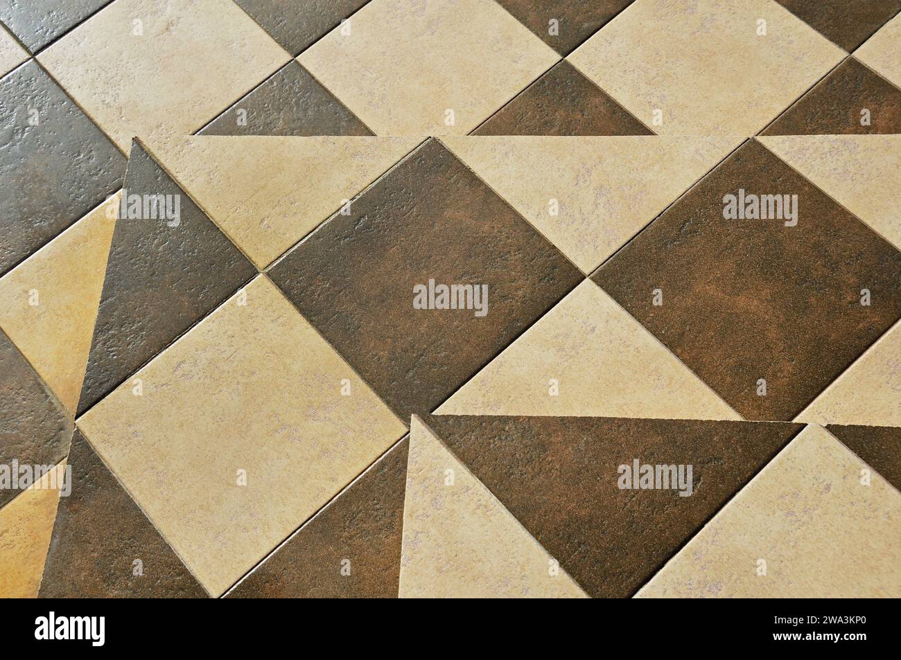 Concrete stairs are decorated with square and triangular ceramic tiles ...