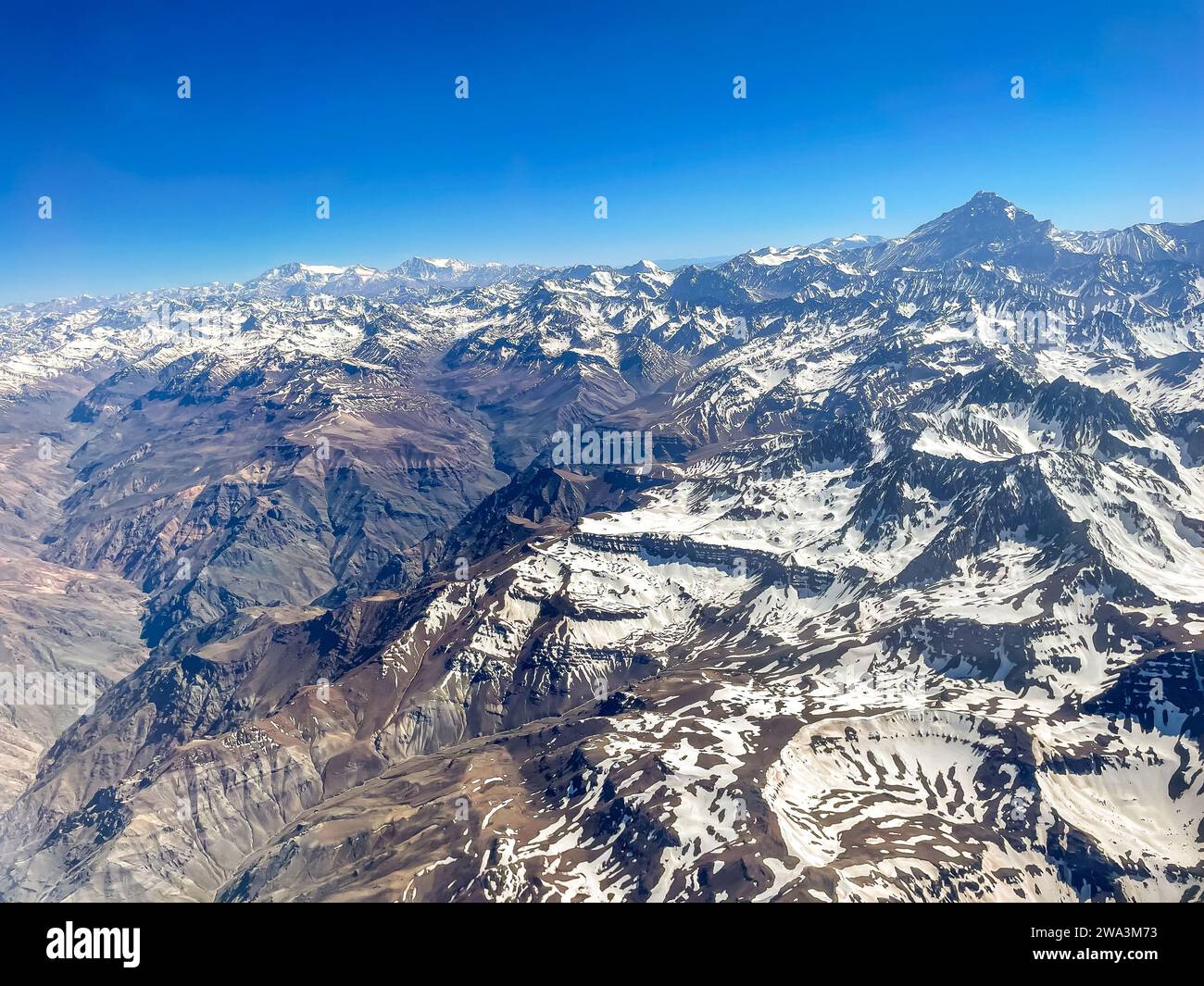 Beautiful aerial view of the plane window of the Andes mountains, cover ...