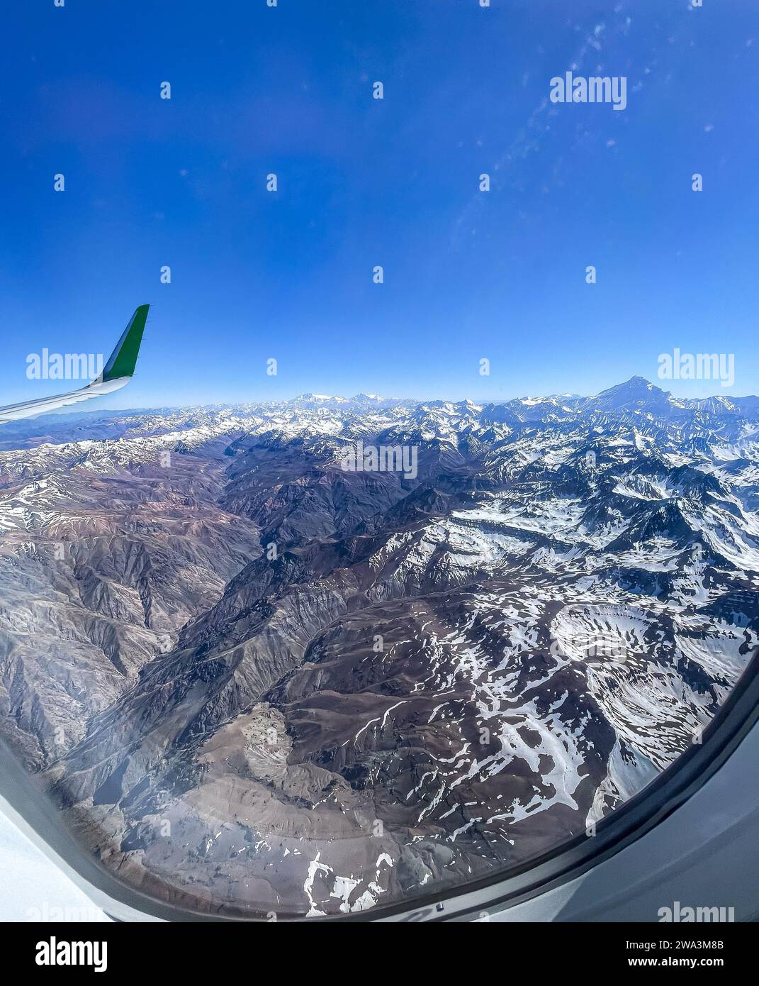 Beautiful aerial view of the plane window of the Andes mountains, cover ...