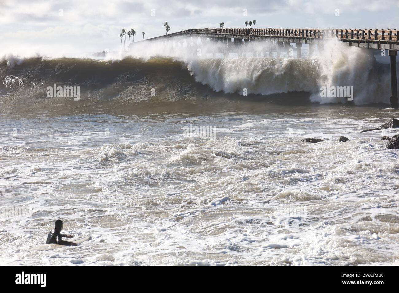 Santa Barbara, California, USA. 30th Dec, 2023. A lone surfer ...