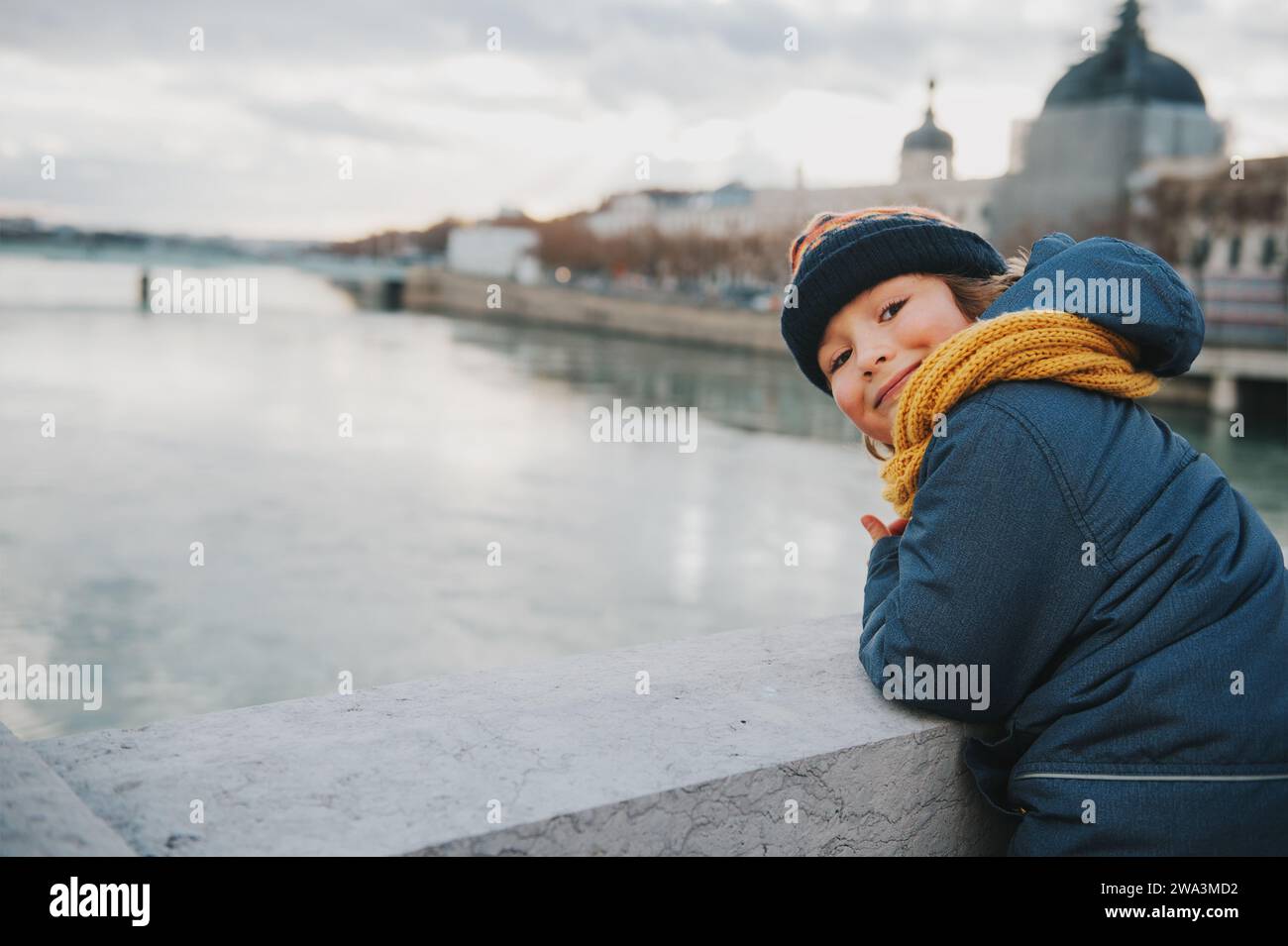 Little kid tourist admiring Rhone river from Bonaparte Bridge, Lyon ...