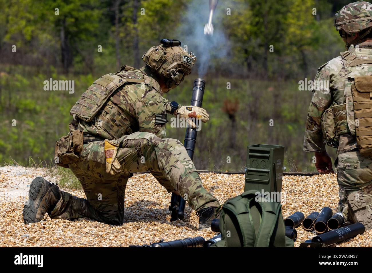 U.S. Army Soldiers aim and fire a handheld and bipod-stabilized 60mm ...