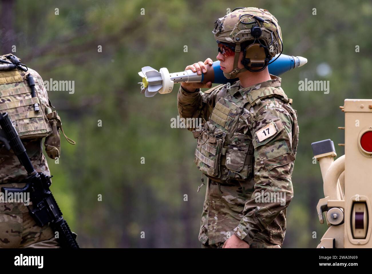 U.S. Army Soldiers aim and fire a 120mm M120A1 Towed Mortar System ...