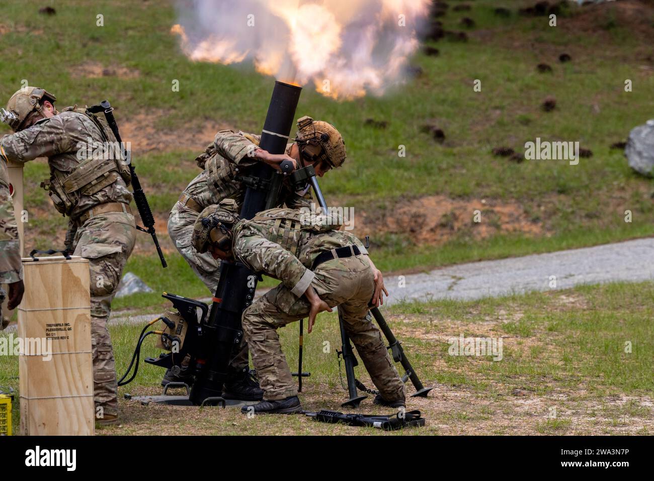 U.S. Army Soldiers aim and fire a 120mm M120A1 Towed Mortar System ...