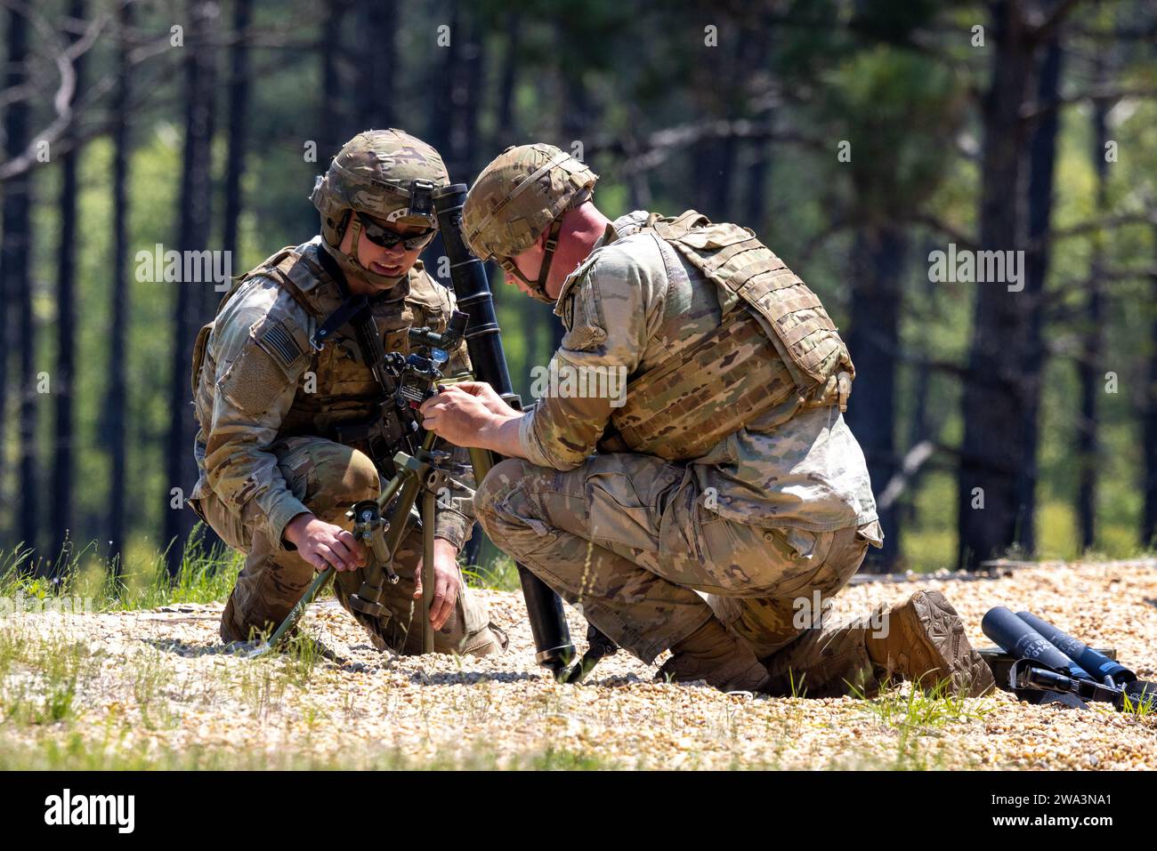 U.S. Army Soldiers aim and fire a handheld and bipod-stabilized 60mm ...