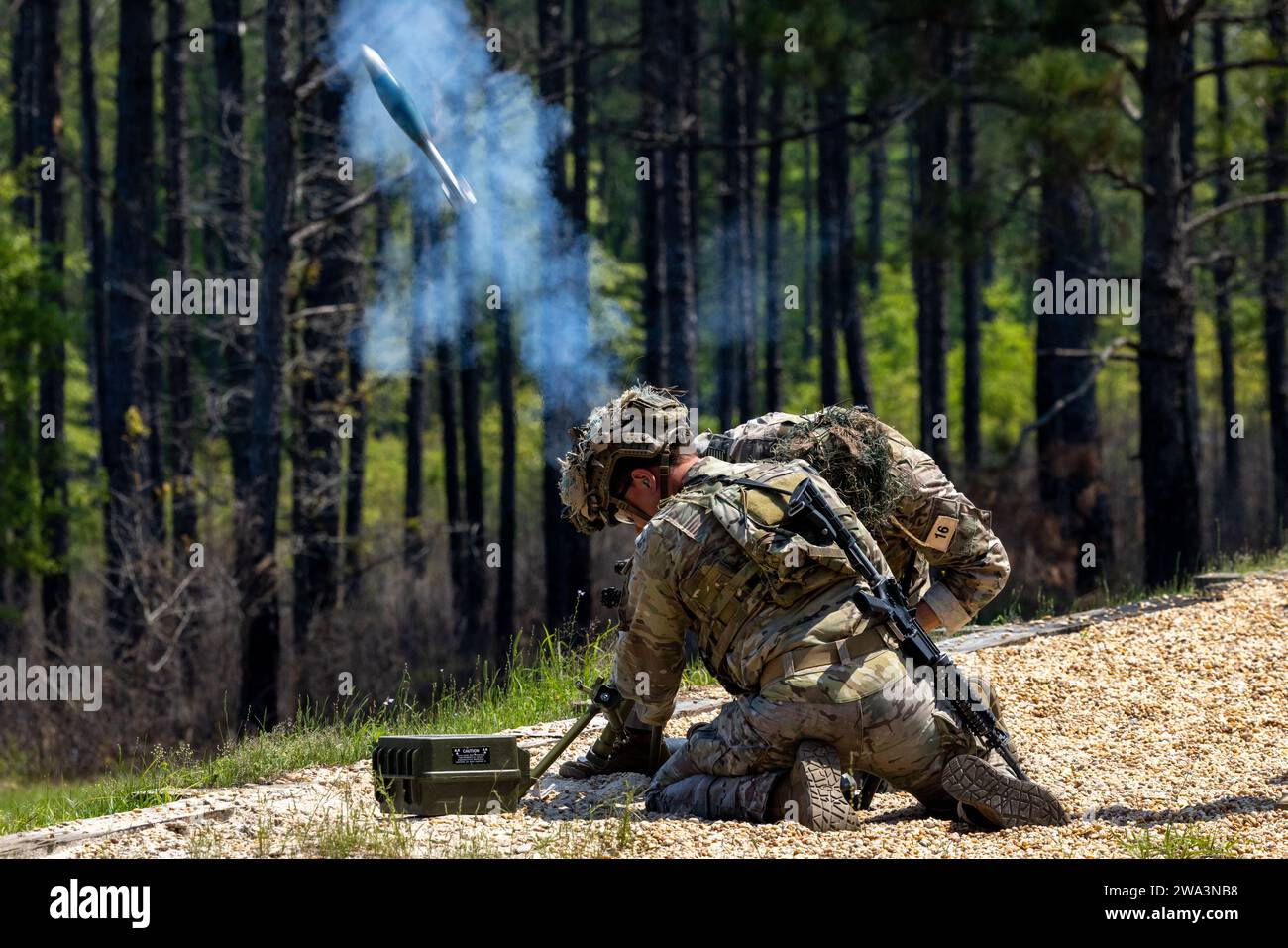 U.S. Army Soldiers aim and fire a handheld and bipod-stabilized 60mm ...