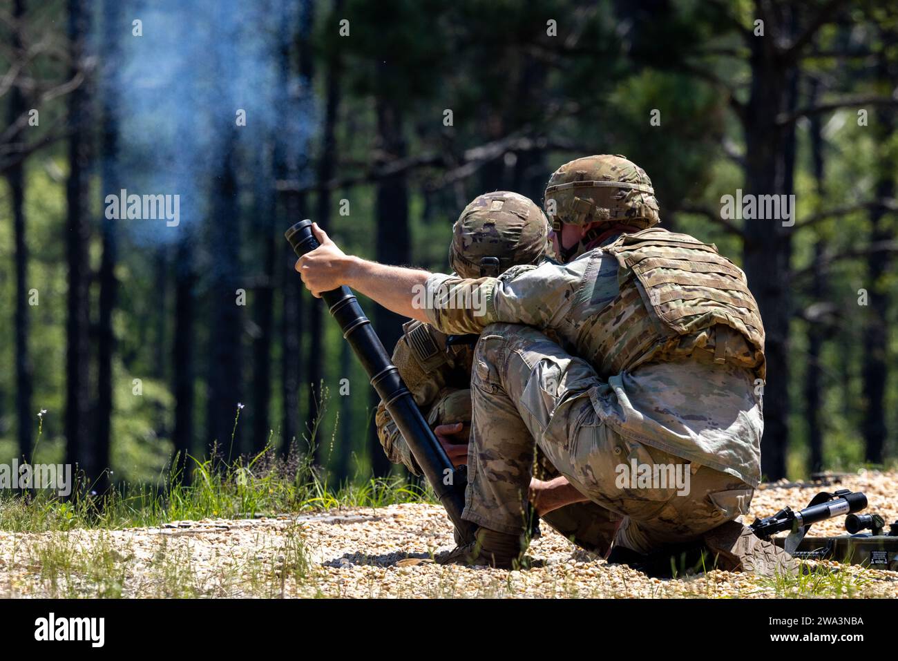 U.S. Army Soldiers aim and fire a handheld and bipod-stabilized 60mm ...