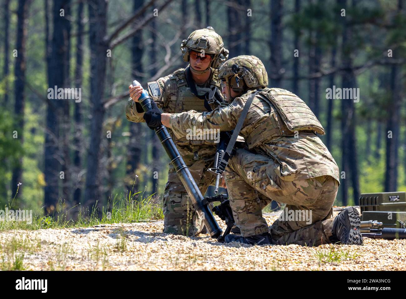 U.S. Army Soldiers aim and fire a handheld and bipod-stabilized 60mm ...