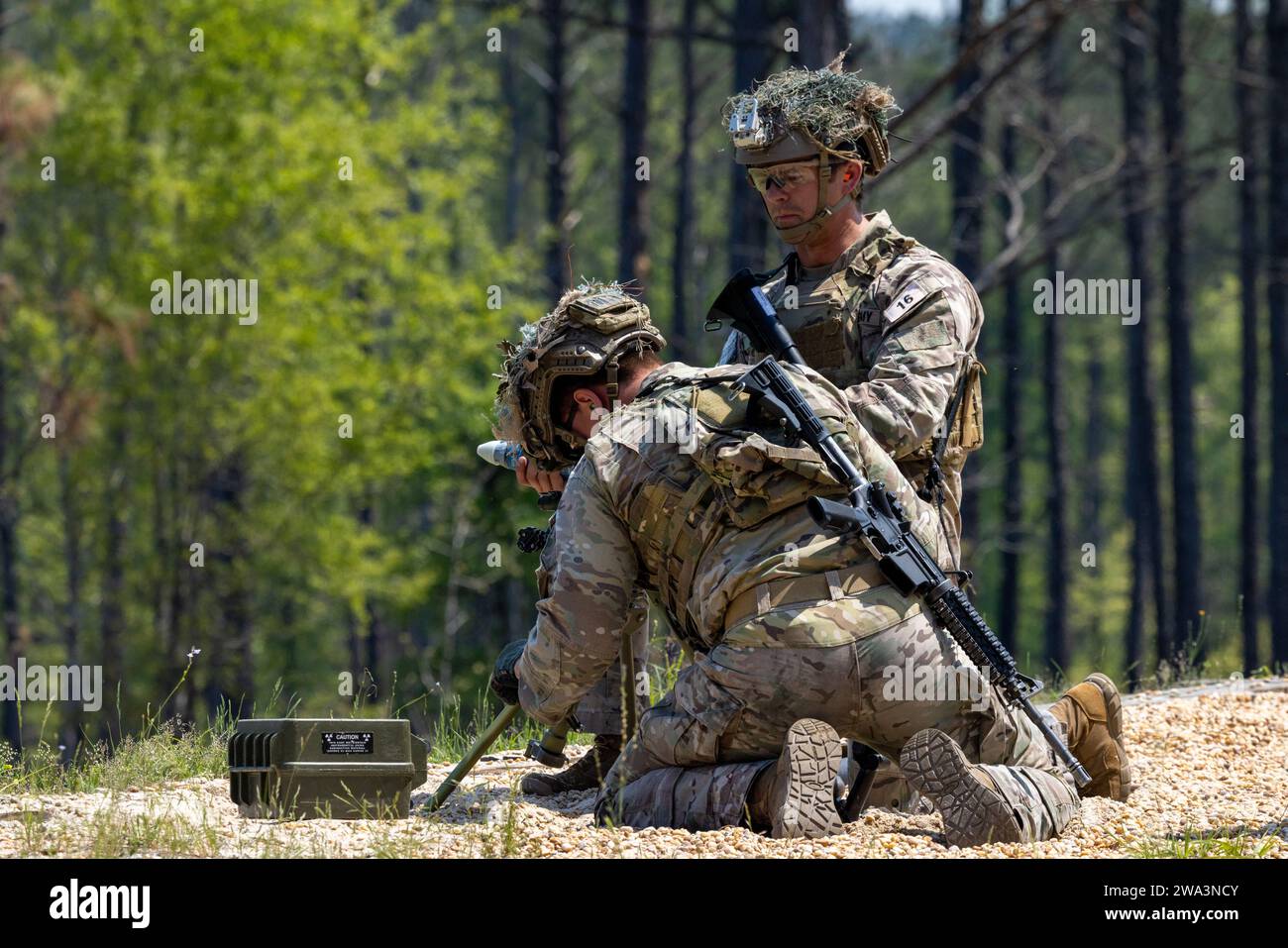 U.S. Army Soldiers aim and fire a handheld and bipod-stabilized 60mm ...
