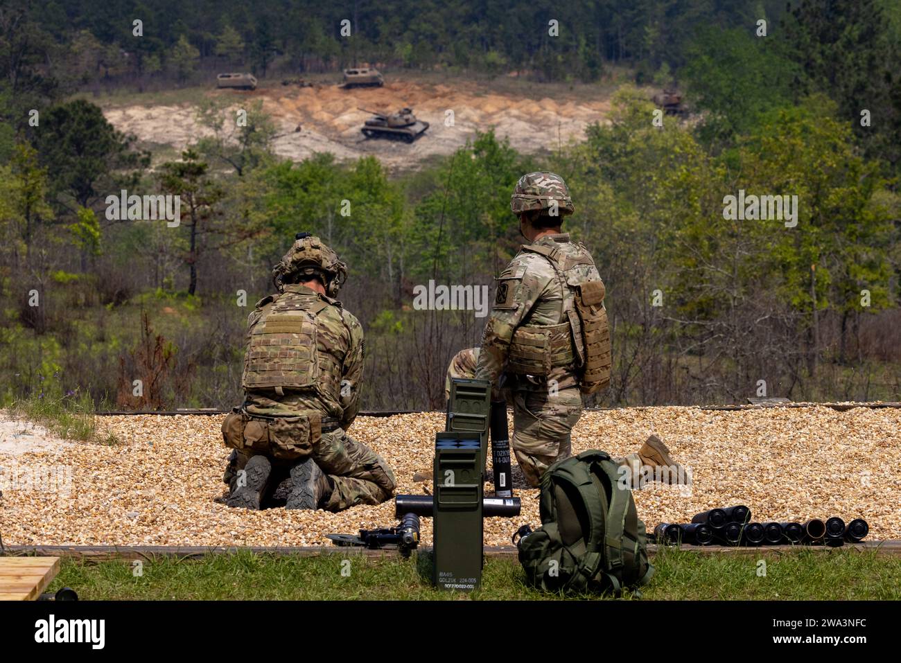 U.S. Army Soldiers aim and fire a handheld and bipod-stabilized 60mm ...