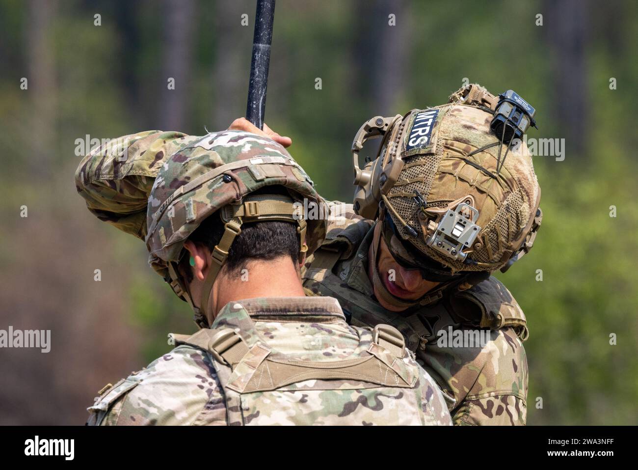U.S. Army Soldiers aim and fire a handheld and bipod-stabilized 60mm ...