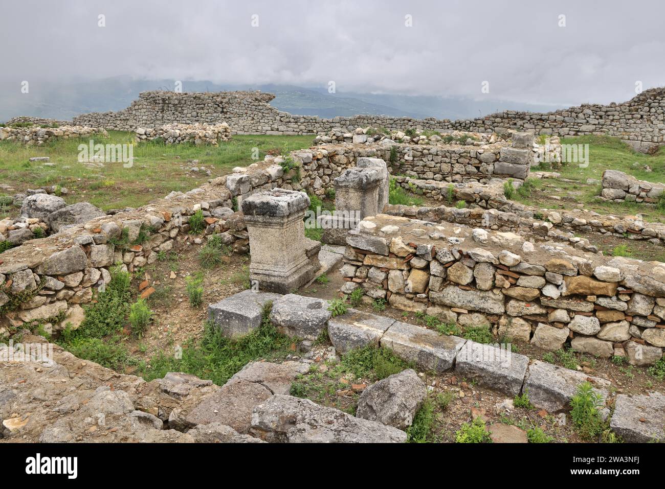 Remains of the Illyrian hilltop settlement of Byllis and view of the ...