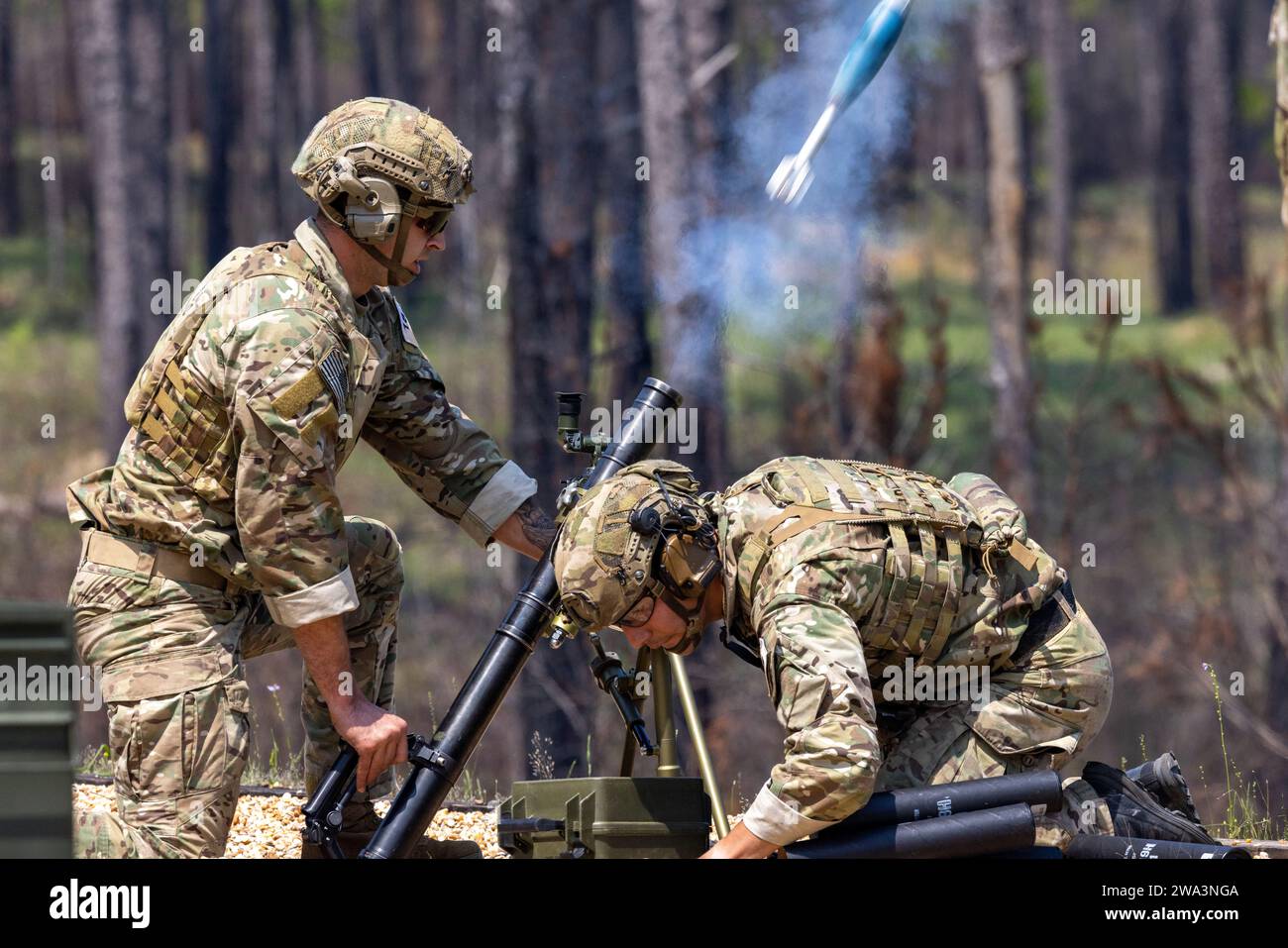 U.S. Army Soldiers aim and fire a handheld and bipod-stabilized 60mm ...