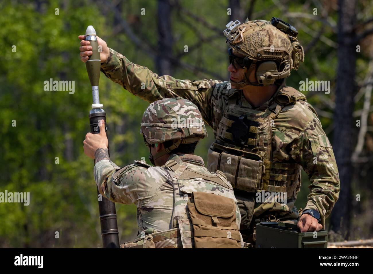 U.S. Army Soldiers aim and fire a handheld and bipod-stabilized 60mm ...