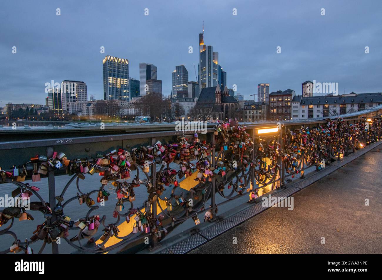 The pedestrian bridge, Iron Footbridge with love locks on the railing ...