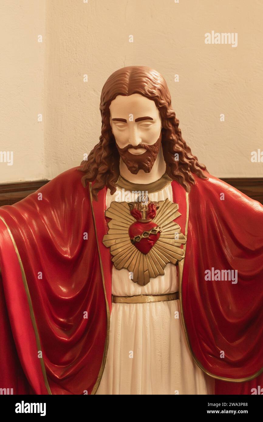 Statue of Jesus with a red heart Stock Photo - Alamy
