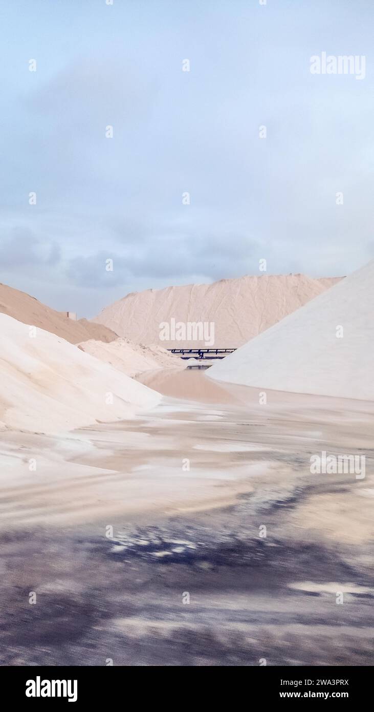 Mountains of sea salt in the salt mining industry of Torrevieja, Spain ...