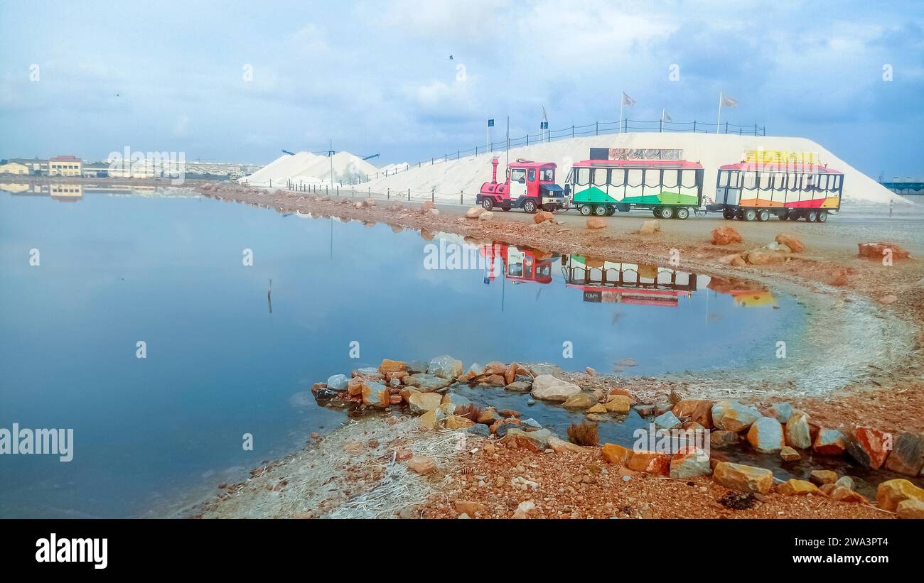 Tourist train in the sea salt mountains at the Torrevieja salt mining ...