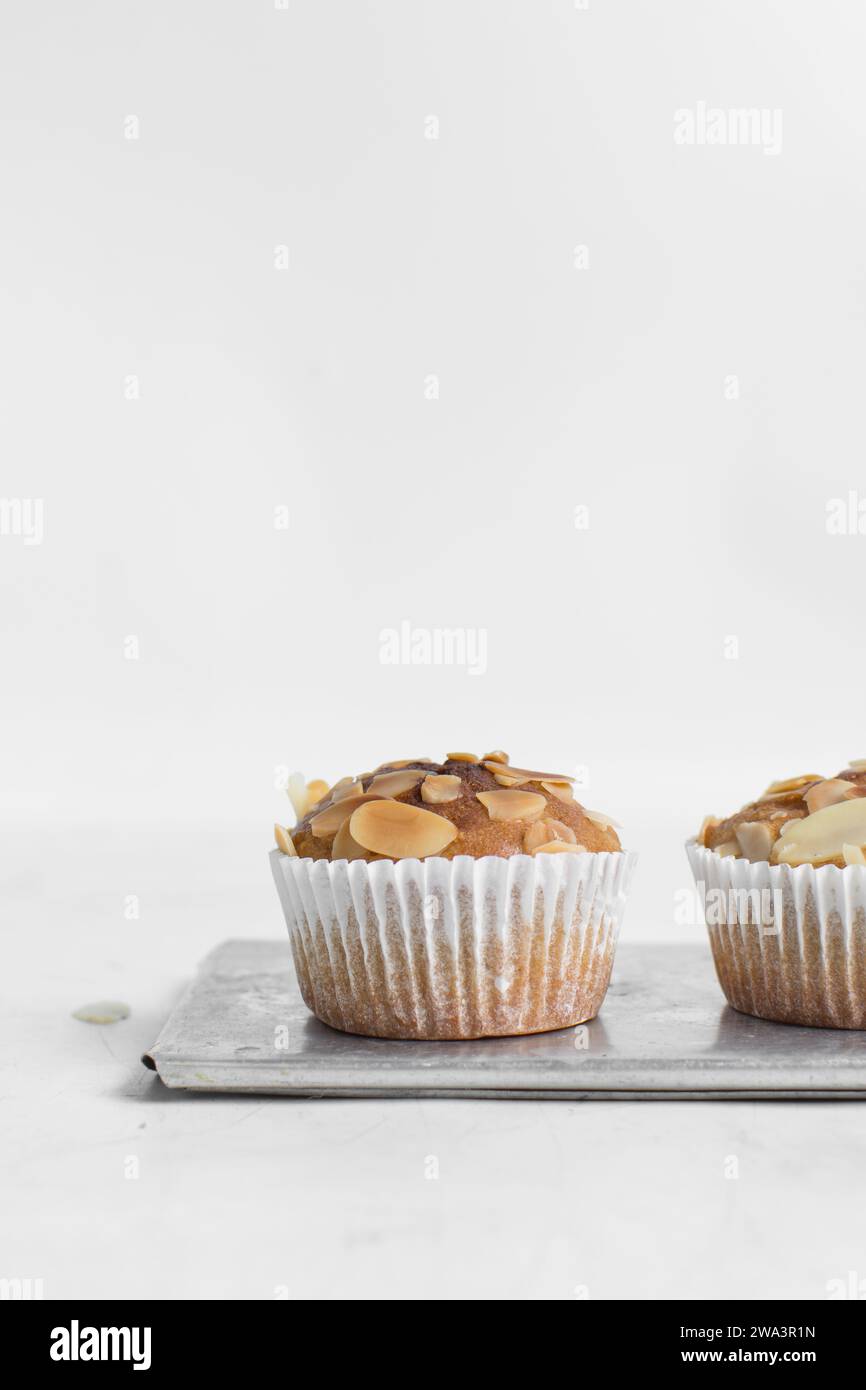 vanilla almond muffins on a silver tray, homemade bakery style almond ...