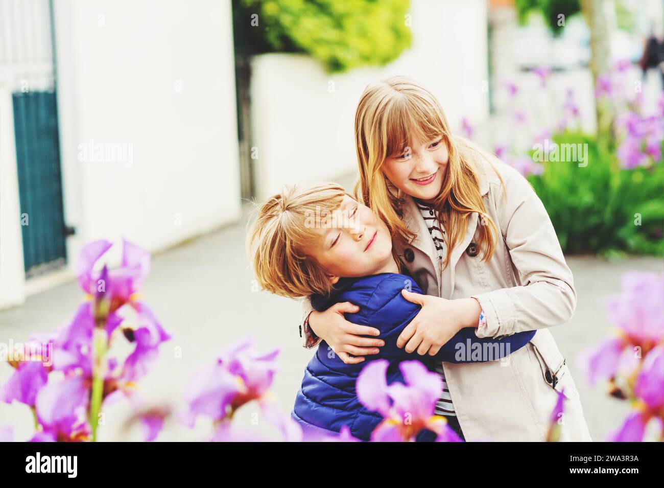 Two funny and happy kids playing together outdoors Stock Photo - Alamy