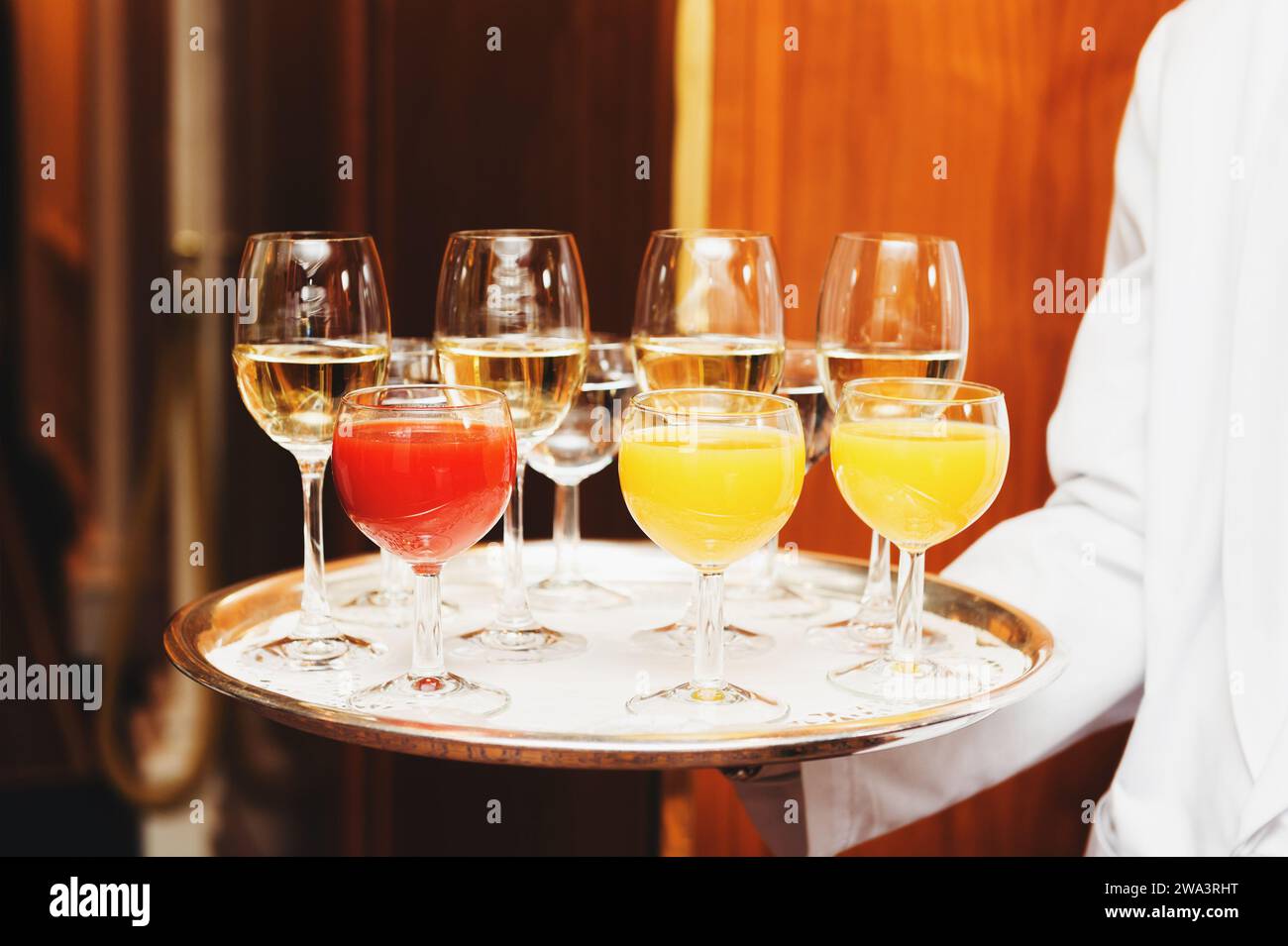 Waiter carrying tray hi-res stock photography and images - Alamy