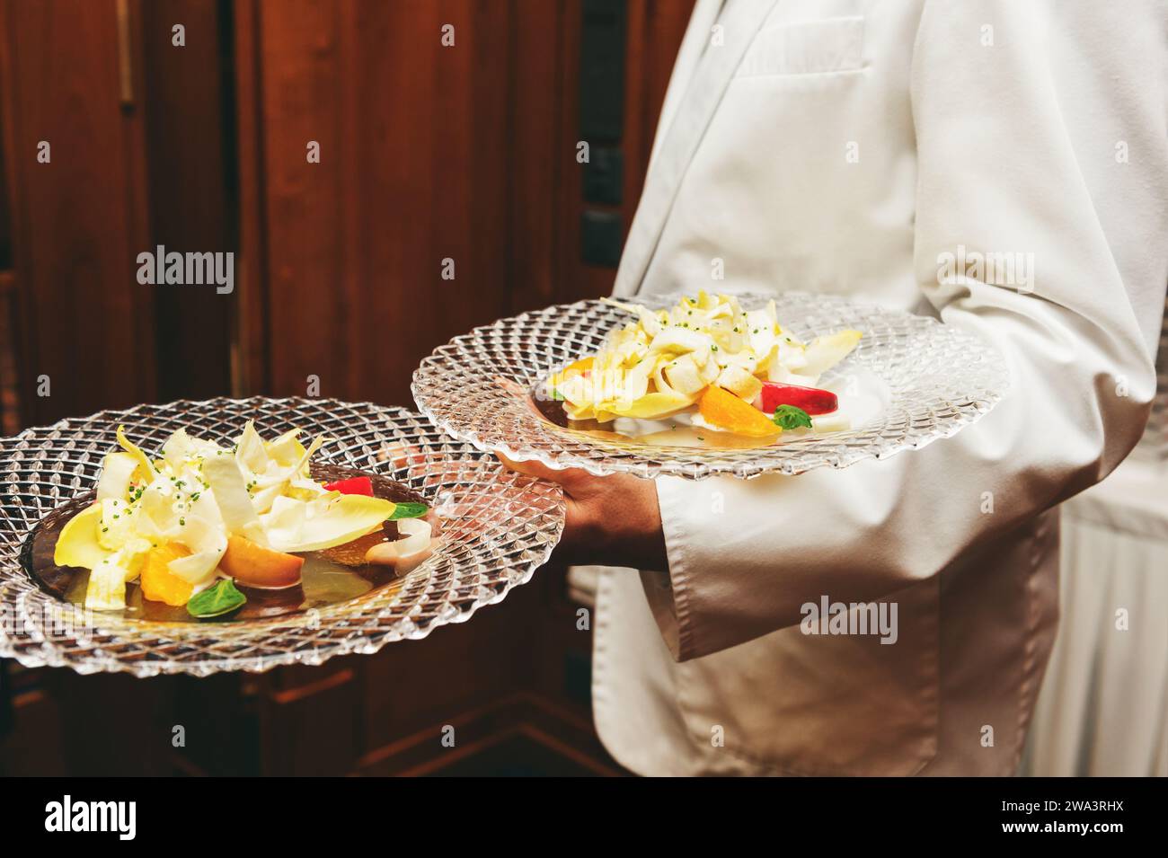 Carrying plates hi-res stock photography and images - Alamy