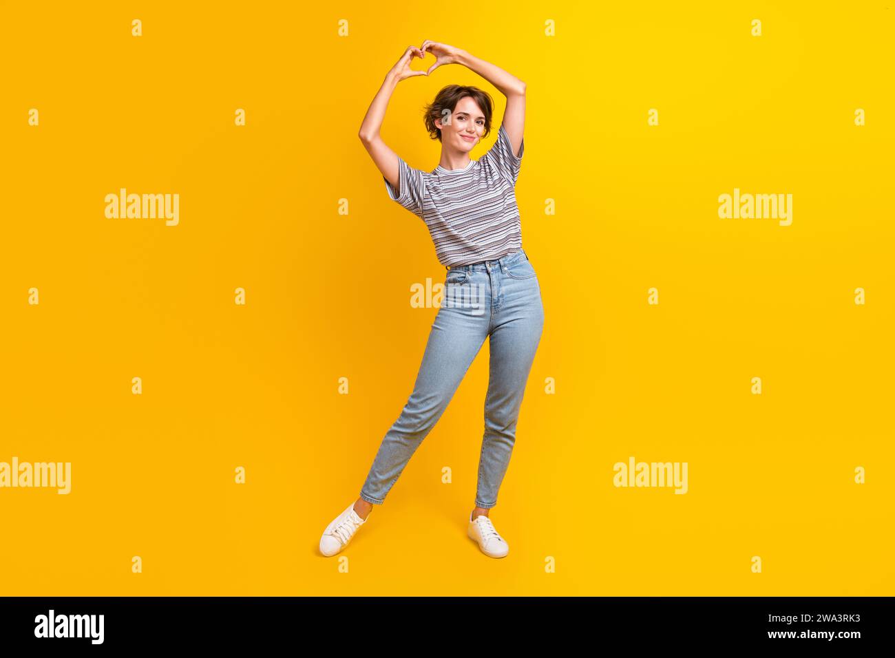 Full size photo of pretty positive girl hands demonstrate heart symbol ...